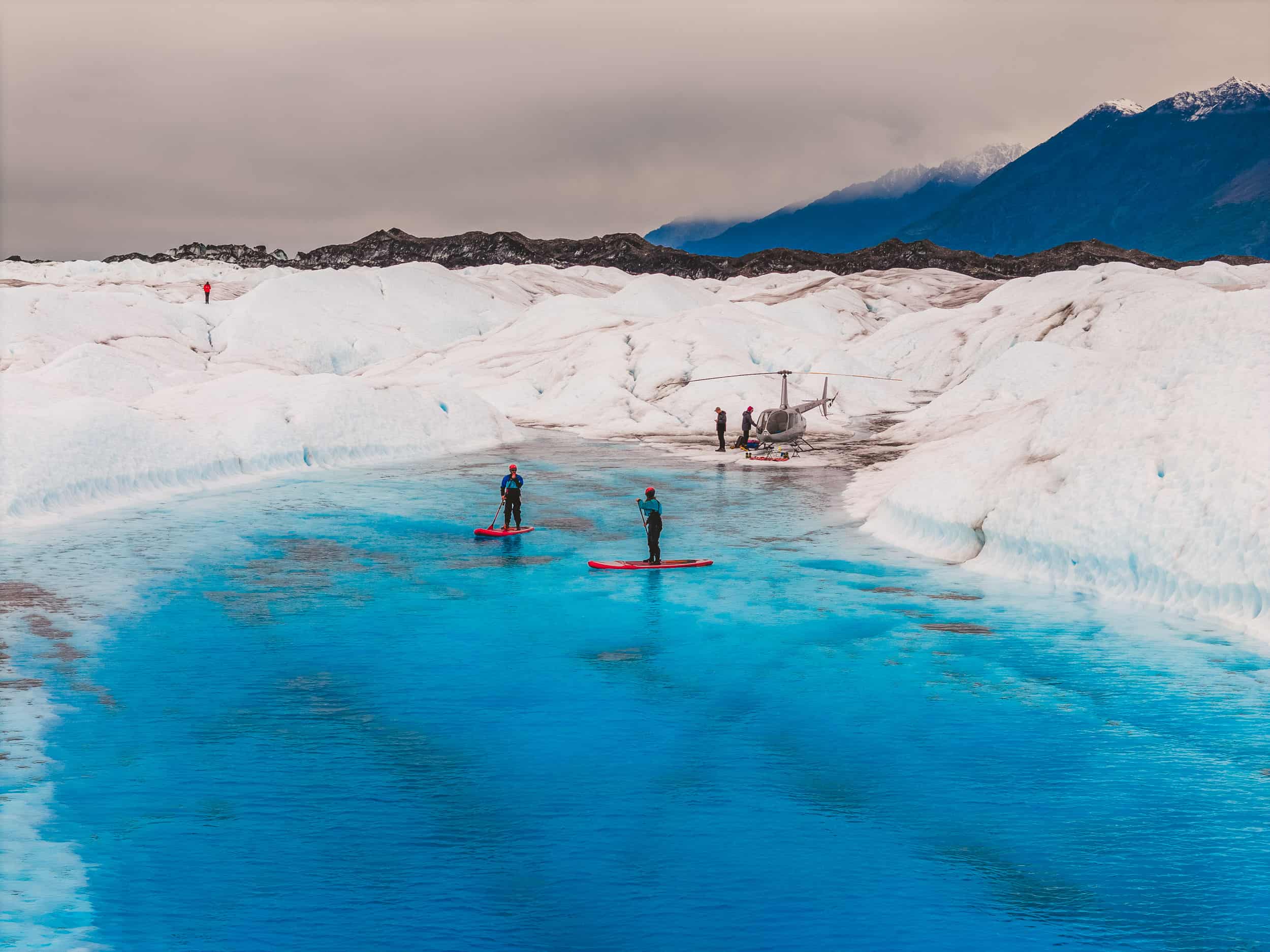 Knik Glacier Paddle Boarding In Alaska - Outbound Heli Adventures